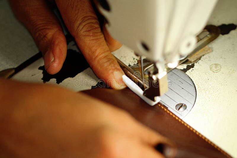 Tailor Working on a Sewing Machine at Textile Factory Stock Photo ...