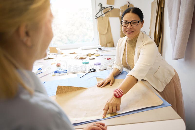 Tailoring Master Greets a Lady Fashion Designer at Her Workplace Stock ...