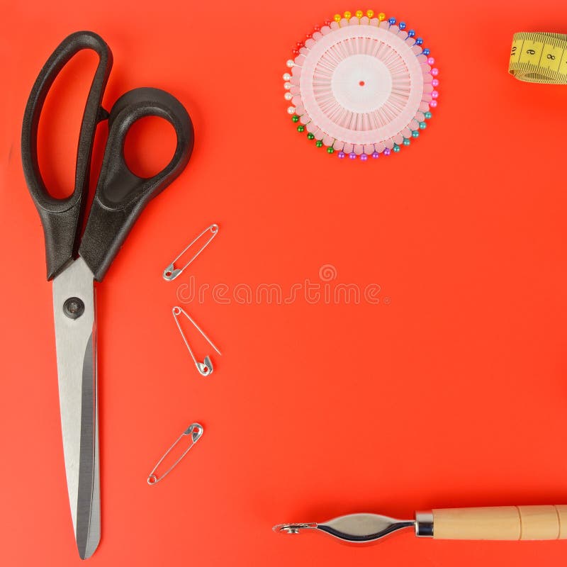 Tailoring Scissors and Pins on a Red Background. Free Space for Stock ...