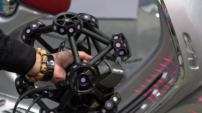 Man Scanning a Motorcycle Using a Measuring Machine 3D Scan High ...