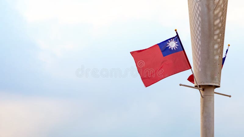 Taiwan Flag Waving a Top a Modern Building with Empty Copy Space for ...