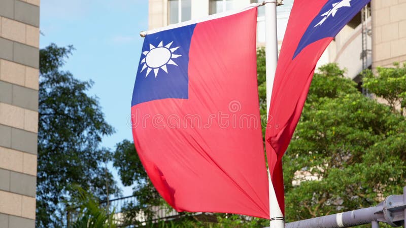 Taiwan Flags Waving in Slow Motion with Building Backdrop Stock Footage ...