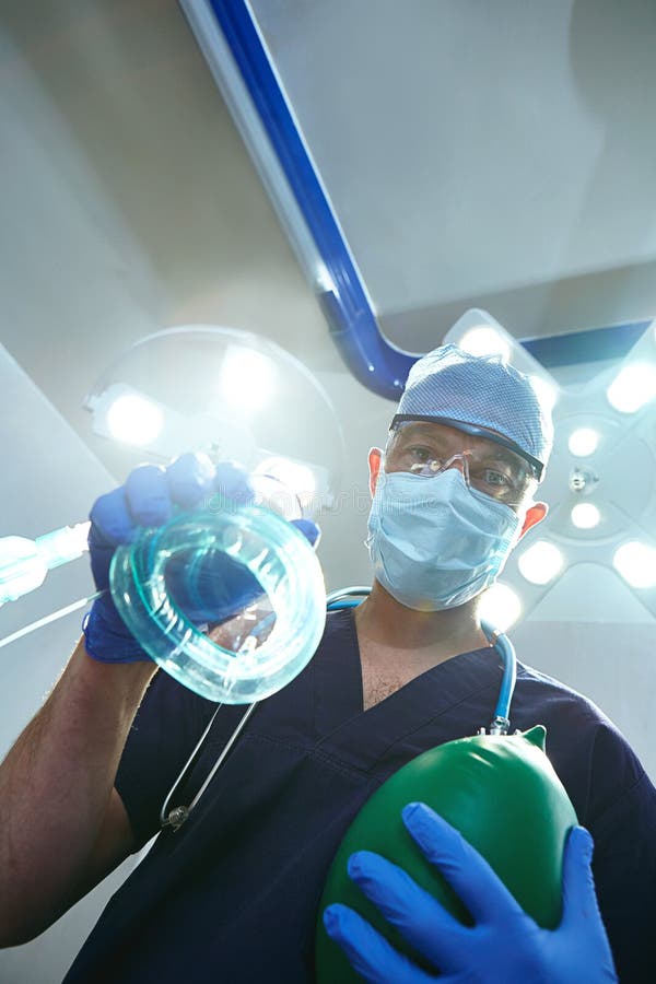 Take a Deep Breath. Low Angle Shot of a Surgeon in an Operating Room ...