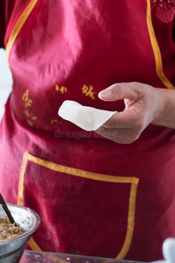 Take Dumpling Skin in Hand and Prepare To Make Dumplings Stock Image ...