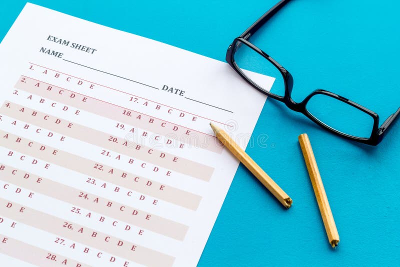 Take the Exam. Exam Sheet Near Glasses and Pencil on Blue Background ...