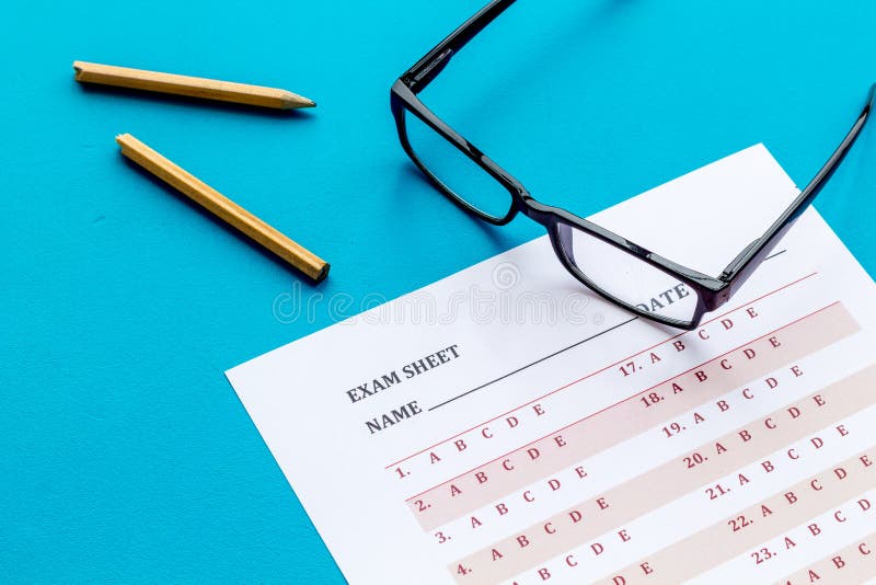 Take the Exam. Exam Sheet Near Glasses and Pencil on Blue Background ...
