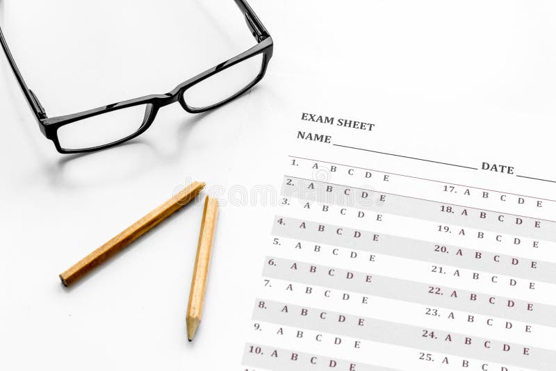 On the Exam. Exam Sheet, Answer Near Glasses and Pencil on Blue ...