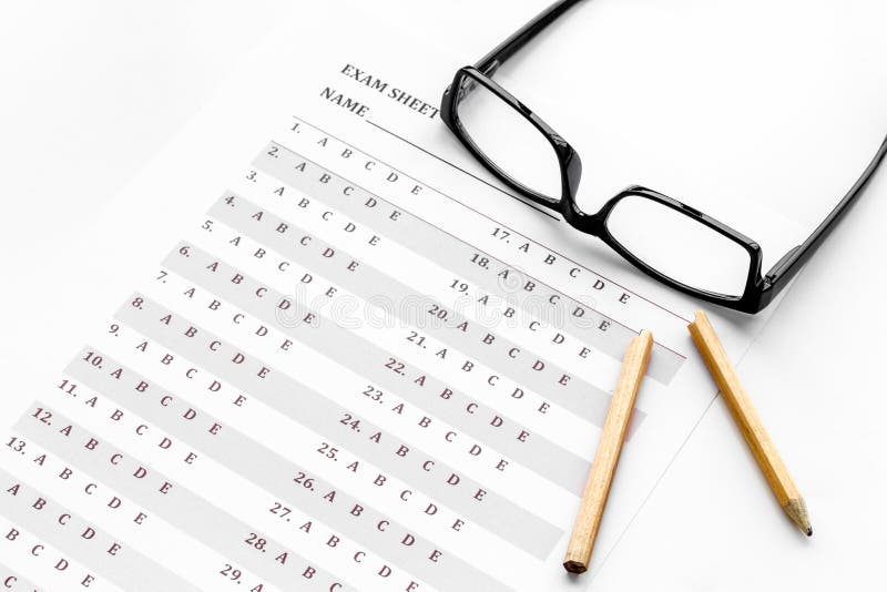 On the Exam. Exam Sheet, Answer Near Glasses and Pencil on Blue ...