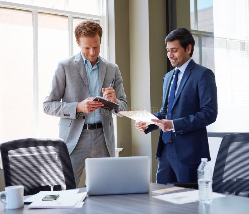 Take a Look at these Figures. Businessmen Looking at Paperwork in Their ...