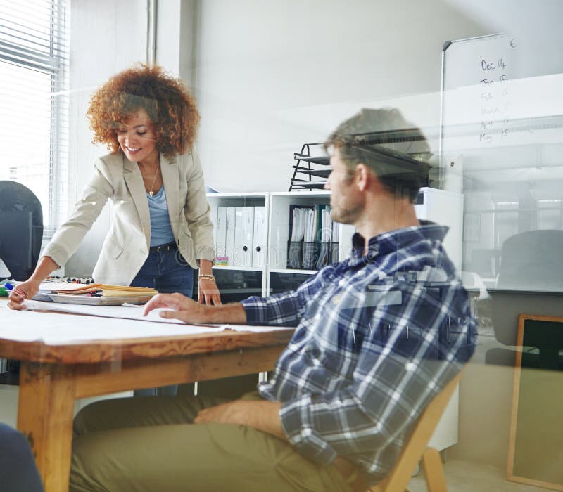 Take a Look at these Figures. Two Coworkers Working in Their Office ...