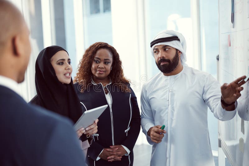 Take a Look Here. a Group of Diverse Business Colleagues Working ...