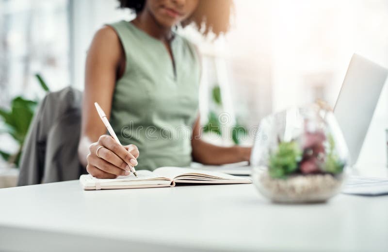 Take Note. an Unrecognizable Young Businesswoman Writing in Her Diary ...