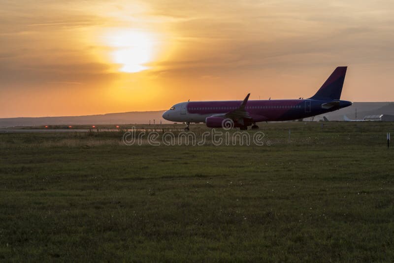 Take-off Plane from the Airport, Shot at Sunset Stock Image - Image of ...