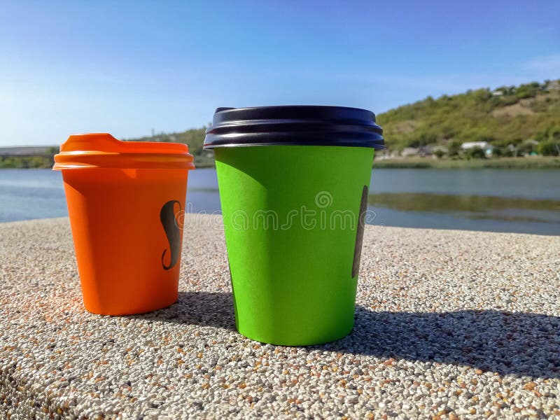 Take-Out Coffee.Two Multi-colored Disposable Portable Paper Coffee Cups ...
