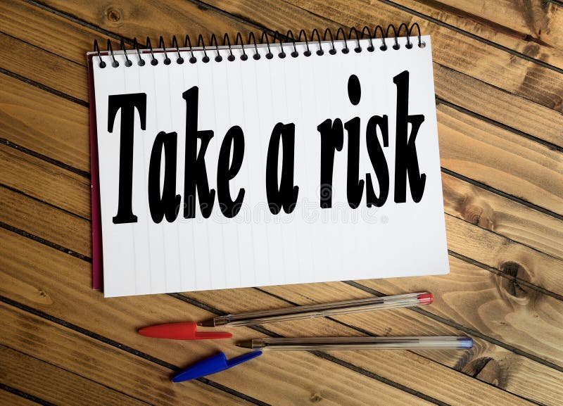 Take the Risk Text Engraved on Old Wooden Signpost Outdoors in Nature ...