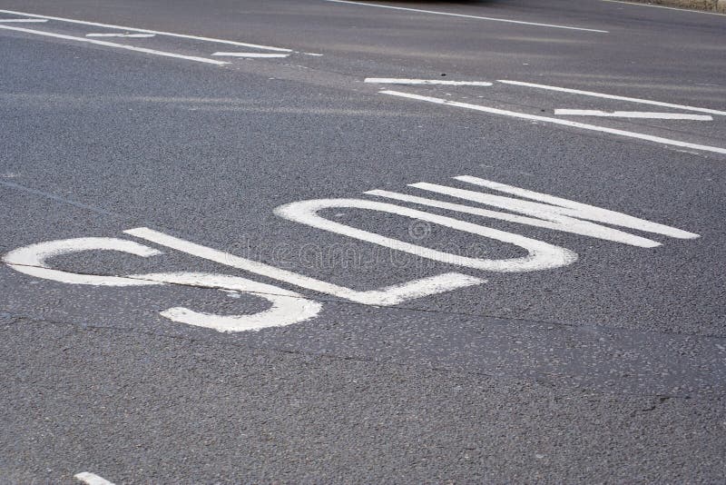 Take it slow stock image. Image of tarmac, words, markings - 18485549