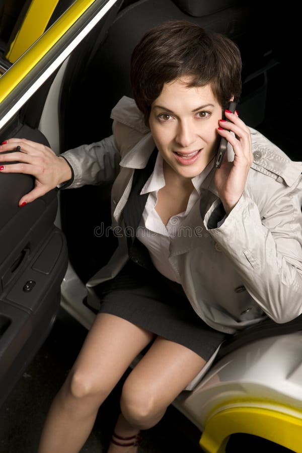 Business Woman Takes Taxi Emerges on Phone Stock Image - Image of door ...