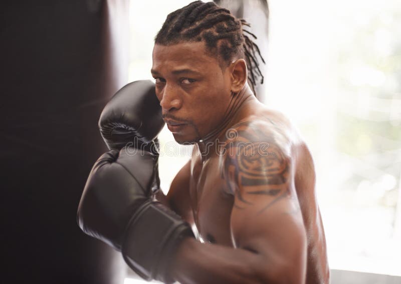 Take Your Best Shot. Portrait of a Young Boxer Practicing in a Gym ...