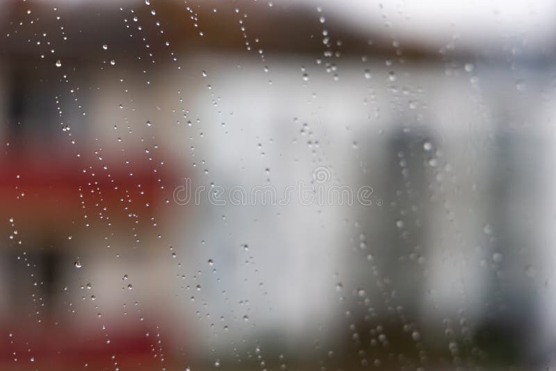 Raindrops on the Window Glass. Blurred View of the Objects Outside the ...