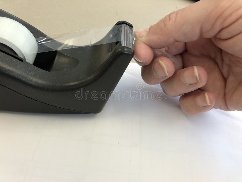Pulling Tape from a Tape Dispenser. Stock Image - Image of finger, limb ...