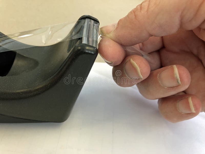 Pulling Tape from a Tape Dispenser. Stock Photo - Image of pulling ...