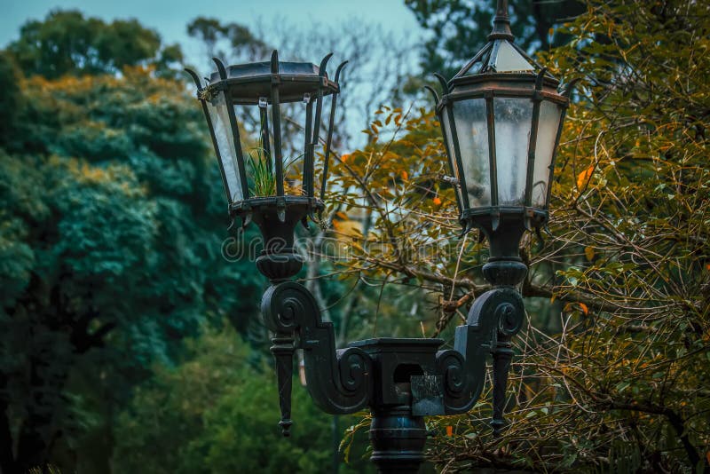 Lamp Post with Two Lights, One Broken Stock Photo - Image of park ...