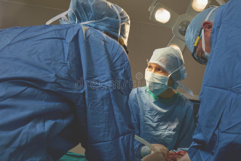 She Takes the Lead in this Operating Room. a Team of Surgeons ...