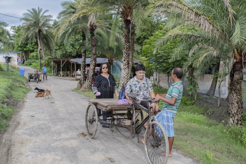 Local Rickshaw Van Puller Transporting Passengers on the Village Road ...