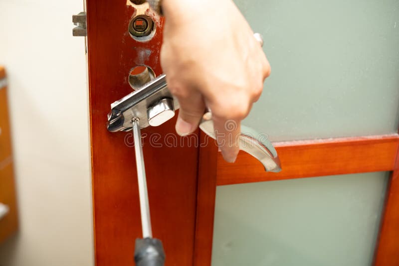 Taking apart door lock stock image. Image of handyman - 229344875