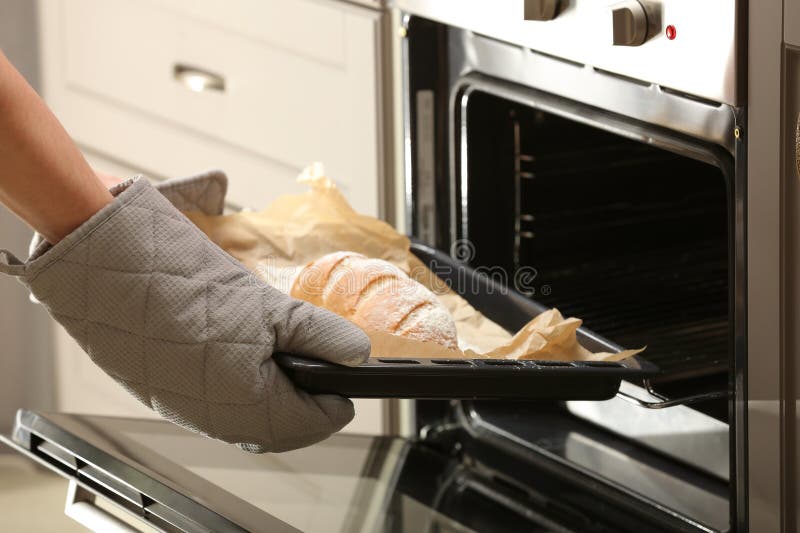 Taking of Baking Tray with Homemade Bread Out of Oven Stock Photo ...