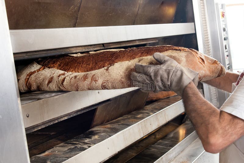 Taking Big Loaf of Bread Out of Oven Stock Image - Image of loaf ...