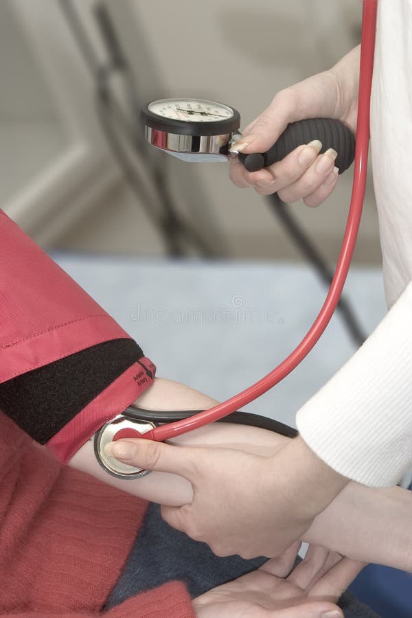 Taking blood pressure stock photo. Image of casually, smiling - 2295264