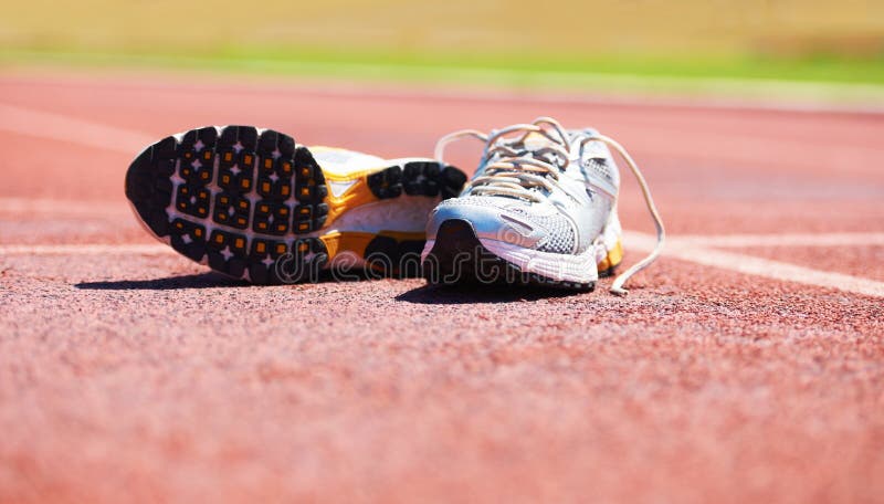 Taking a Break from the Race. a Pair of Running Shoes Lying on a ...