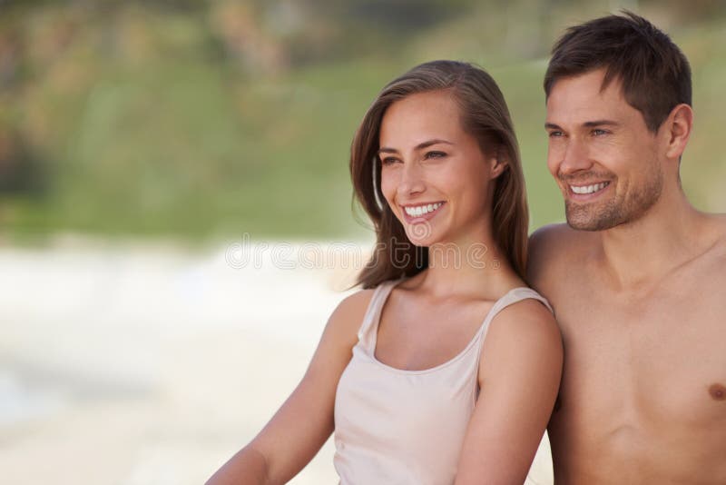 Taking a Break from Real Life. a Happy Young Couple at the Beach. Stock ...