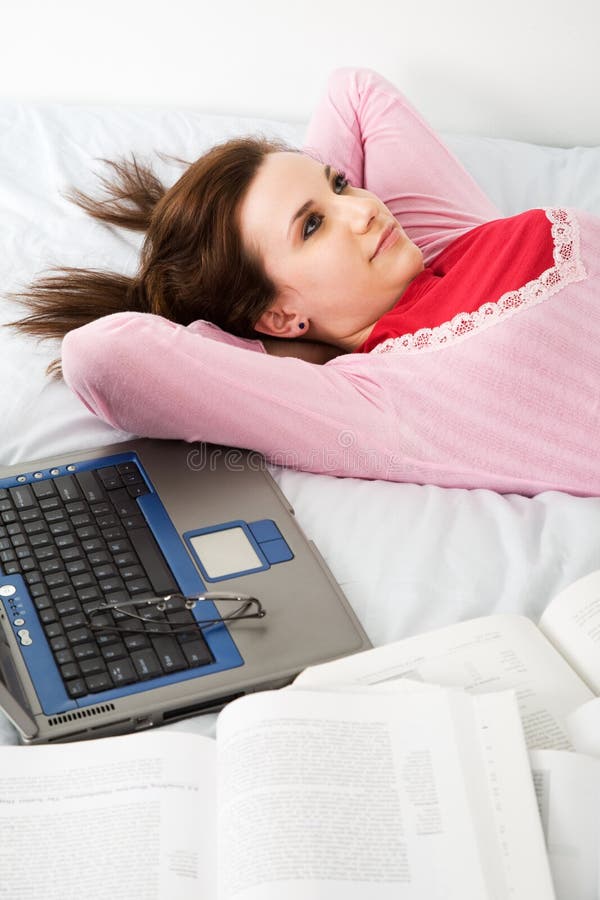 Taking a Break from Studying Stock Image - Image of beauty, bedroom ...