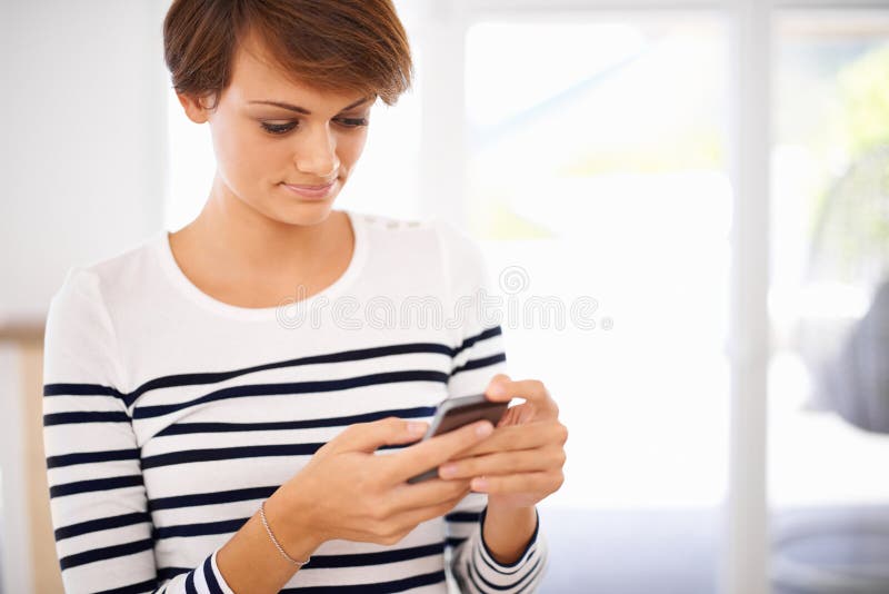 Taking a Break To Send a Text. a Beautiful Young Woman Texting on Her ...