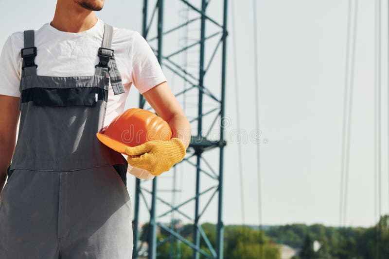 Taking a Break. Young Construction Worker in Uniform is Busy at the ...