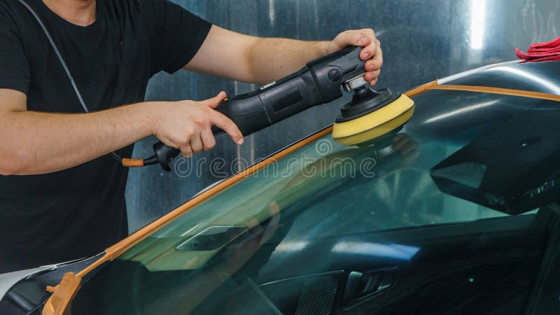 Taking Care of the Car S Appearance. the Master Polishes the Windshield ...