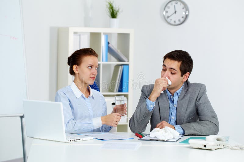 Taking Care of Sick Co-worker Stock Image - Image of cold, corporate ...