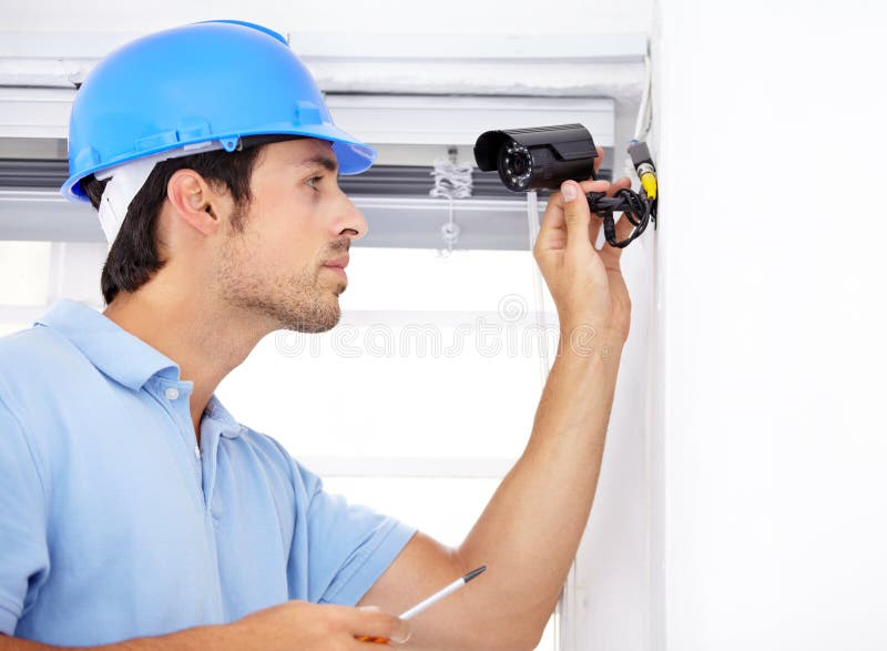 Taking Care of Your Security Needs. Shot of a Handsome Young Man ...