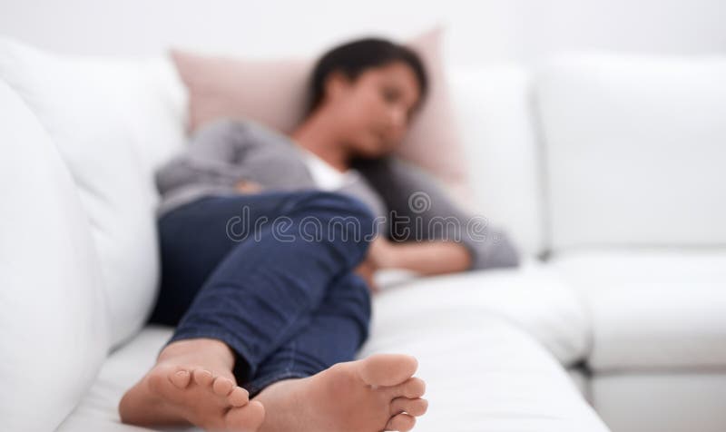Taking a Cat Nap. a Young Woman Taking a Nap on Her Sofa. Stock Image ...