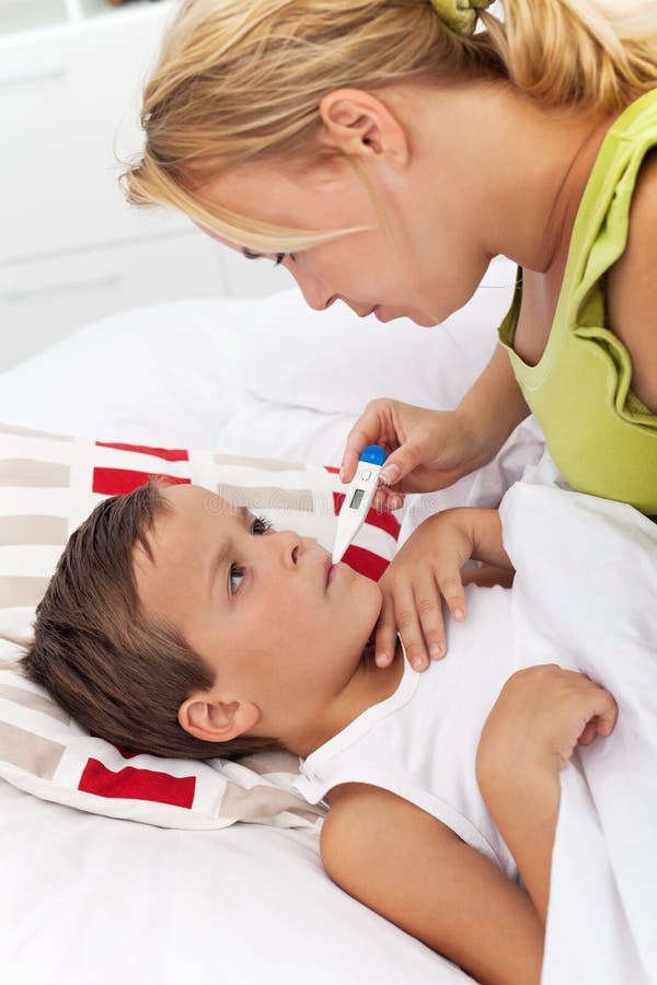 Woman Checks Temperature To Child Stock Image - Image of care ...