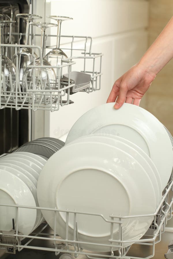 Taking clean plate stock photo. Image of indoors, cleaning - 26155318