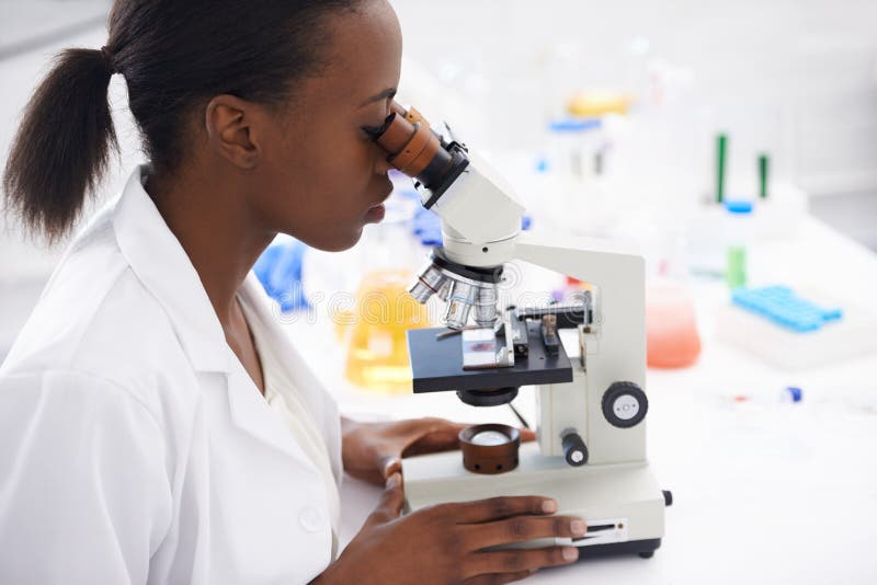 Taking a Closer Look at those Bacteria. a Female Biologist Looking at a ...