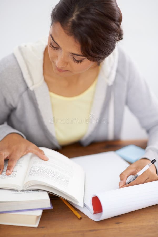 Taking Down Some Important Notes. Closeup Shot of a Pretty College ...