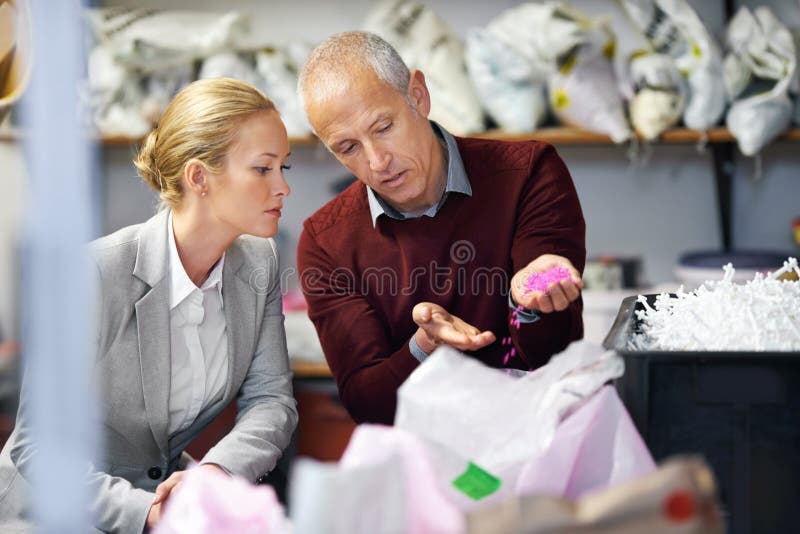 Taking His Expert Advice. Two People in a Plastic Factory. Stock Image ...