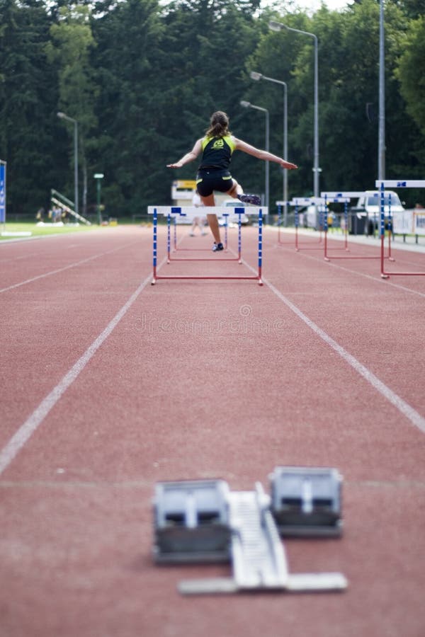 Taking hurdles stock image. Image of woman, spring, jump - 2515849