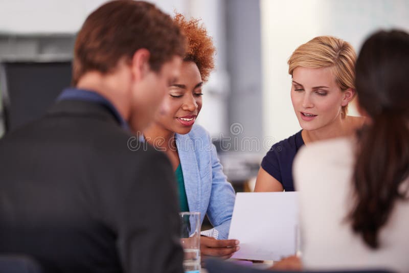 Taking a Look at the Paperwork. Businesspeople in a Meeting. Stock ...