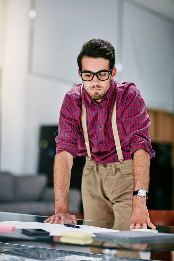 Taking a Look at Some Designs. a Handsome Young Designer Looking at ...