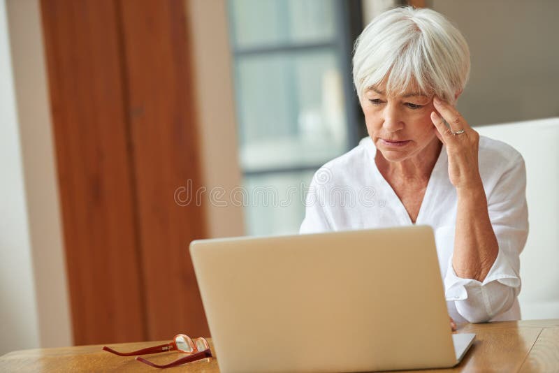 This is Taking Me Forever. a Senior Woman Using a Laptop. Stock Photo ...